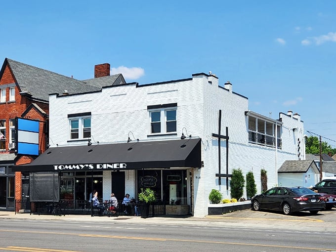 Clean white brick and black trim signal serious diner business – no frills, just fantastic comfort food ahead.