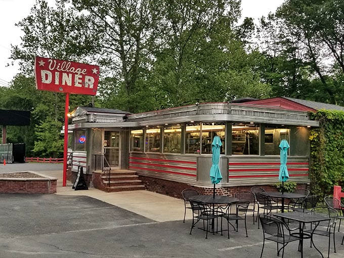 Village Diner's classic silver exterior with red stripes looks like it was plucked straight from an Edward Hopper painting.