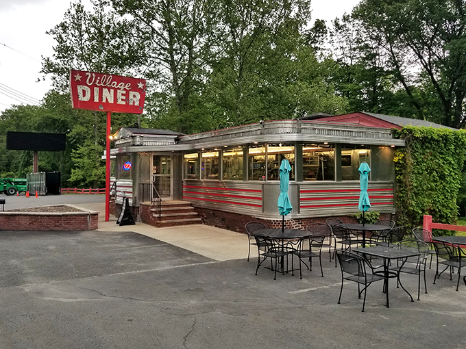Chrome and dreams—this classic diner car looks ready for its Hollywood close-up. Those outdoor tables are prime people-watching real estate.