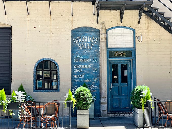 Old-world charm meets modern donut mastery. Doughnut Vault's beautiful blue façade and hand-painted menu board transport you to simpler times.