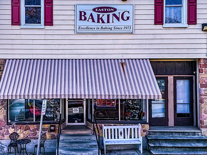 That striped awning signals you've arrived at tomato pie paradise – Easton Baking Company's modest exterior belies its legendary status.