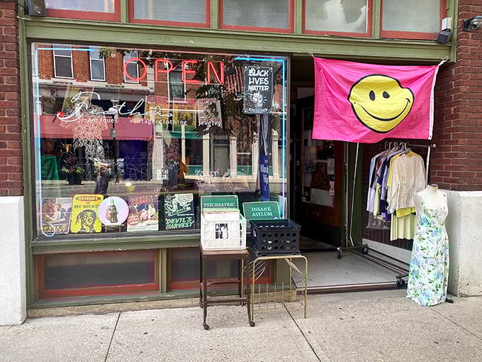 The cheerful yellow smiley flag says it all—Feathers is where vintage fashion goes to make new friends and find happy homes.