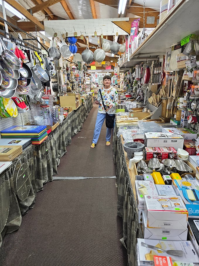 Indoor market buzzes with activity as vendors and customers create the perfect bargain hunting atmosphere.