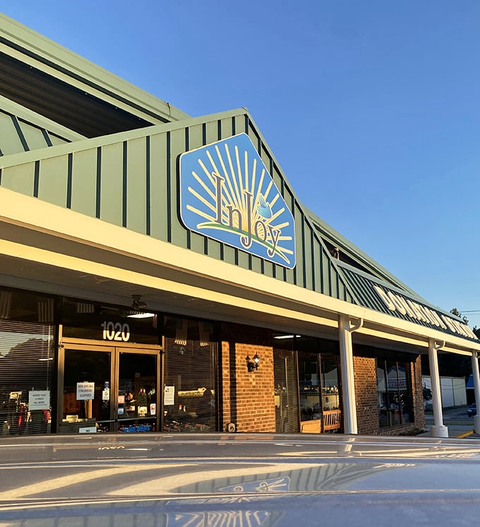 The sunny facade of InJoy Thrift Store features their cheerful sunburst logo—a perfect symbol for the bright deals waiting inside this Rocky Mount treasure trove.