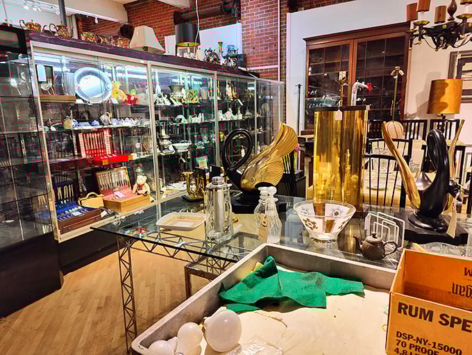 Elegant glass cases showcase delicate treasures while brick walls add warmth—this corner of Midland Arts feels like a museum where you can take things home.