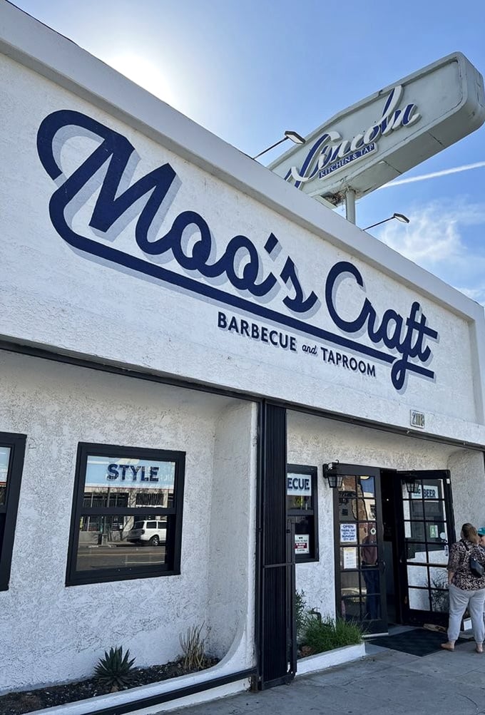 The warm glow of Moo's Craft Barbecue promises a meat experience worth crossing town for—possibly worth crossing state lines for.