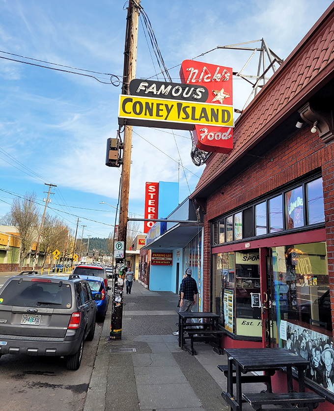 The vintage neon glow promises authentic Coney Island magic in the heart of Portland's bustling Hawthorne district.
