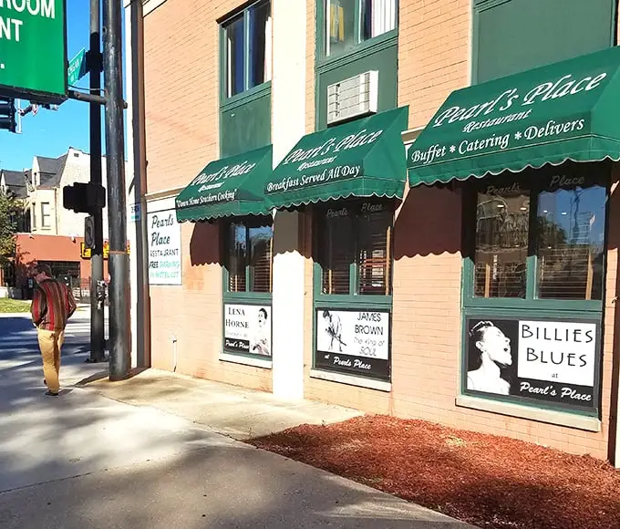 Green awnings and brick walls frame decades of soul food excellence on Michigan Avenue.
