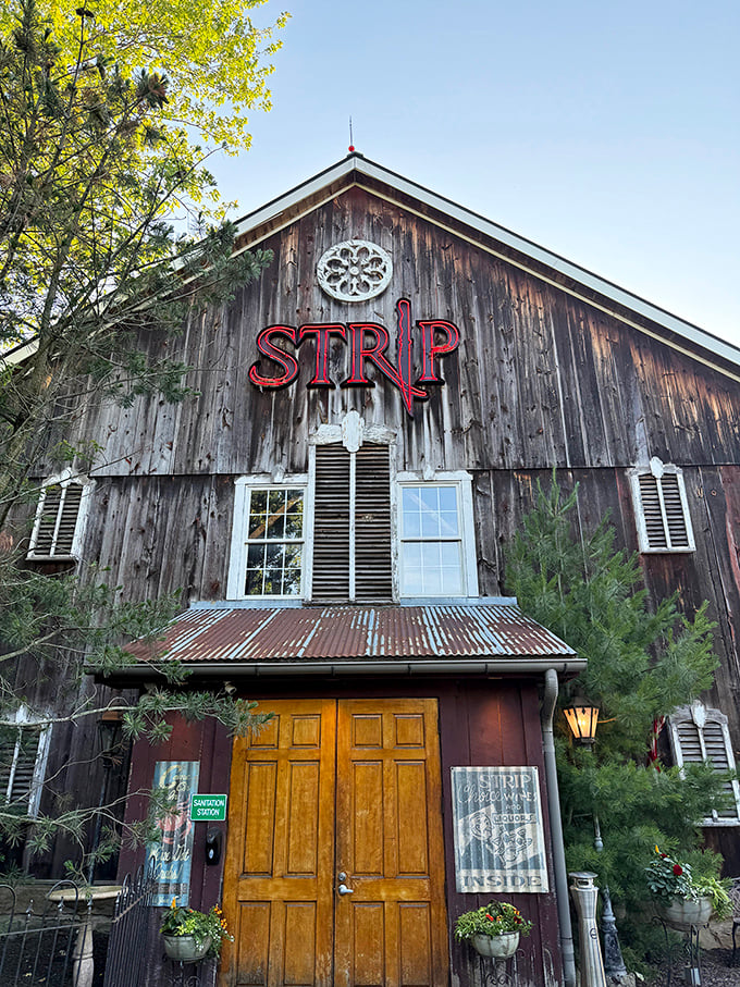 The weathered wood exterior whispers promises of perfectly grilled steaks waiting inside.