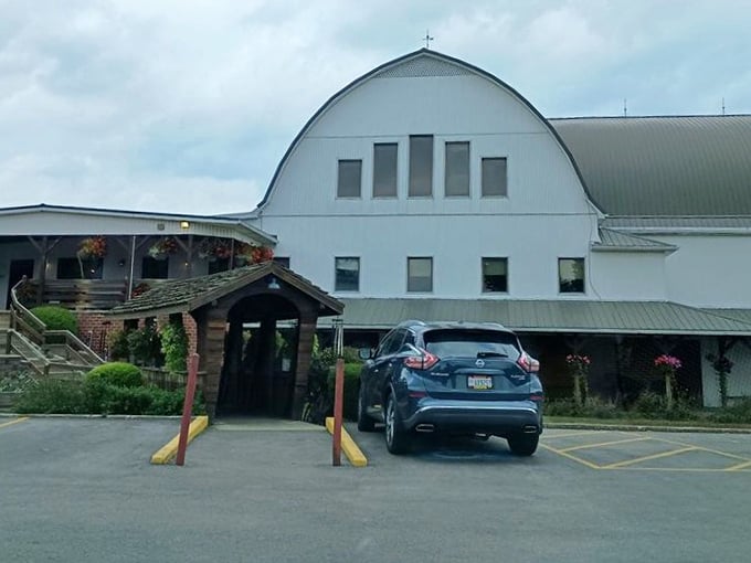 This isn't just any barn—it's The Barn, where country comfort food finds its perfect home under those authentic rafters and beside that towering silo.