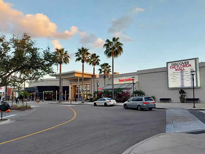 Modern architecture meets palm tree paradise, where Zara and H&M live in perfect retail harmony under the Florida sun.