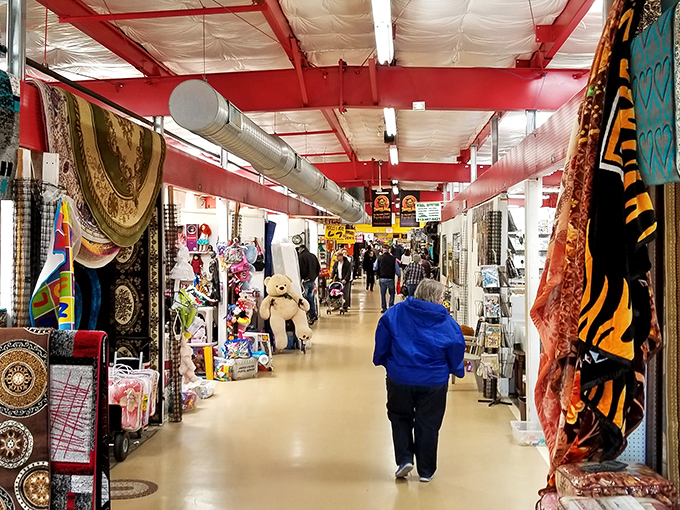 Treasure hunters navigate this bustling indoor marketplace, where every aisle holds potential discoveries worth bragging about later.