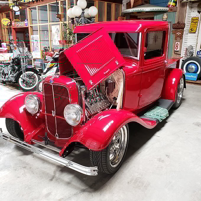 This cherry-red '32 Ford hot rod gleams with the kind of perfection that makes grown men whisper and car enthusiasts weak in the knees.