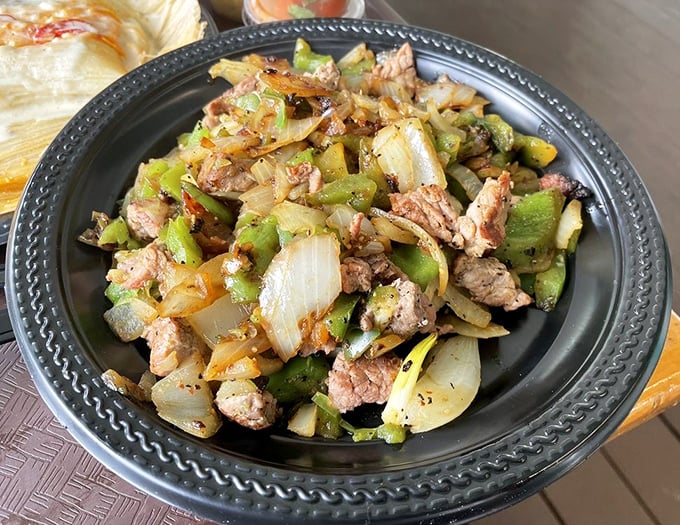 A fiesta of flavors on a plate. This sautéed medley of meat, peppers, and onions proves simplicity and excellence are perfect dance partners.