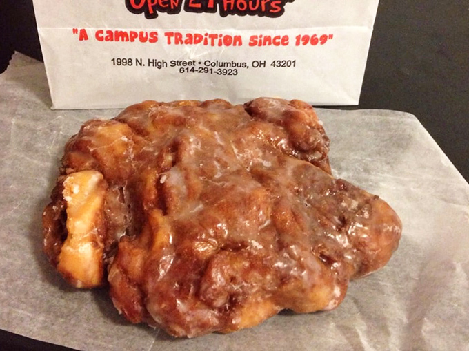 The apple fritter—a magnificent landscape of cinnamon-spiced goodness that's less a pastry and more an edible work of abstract expressionism.