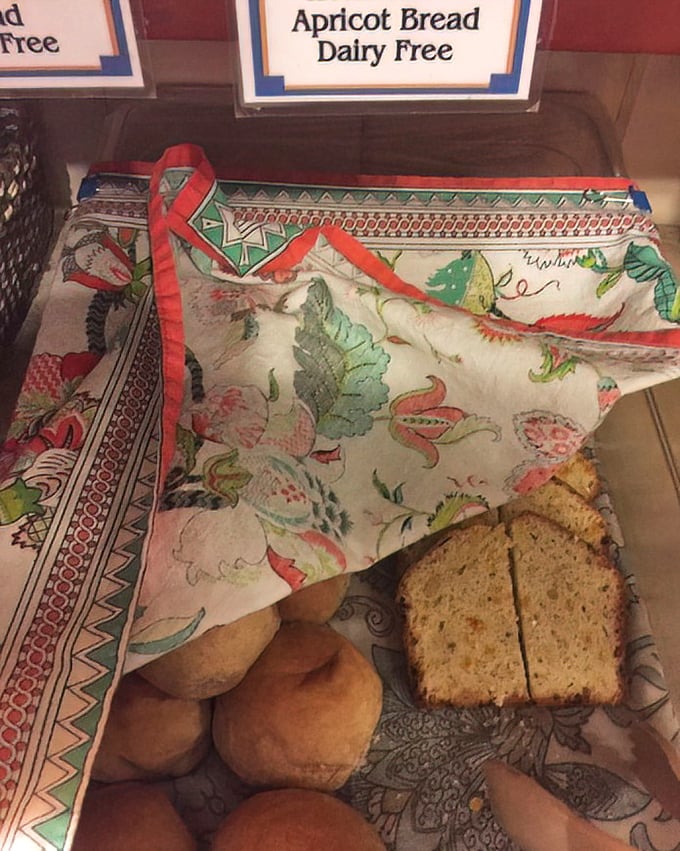 Apricot bread nestled in colorful cloth—like receiving a delicious gift from a grandmother who knows exactly what comfort food should taste like.
