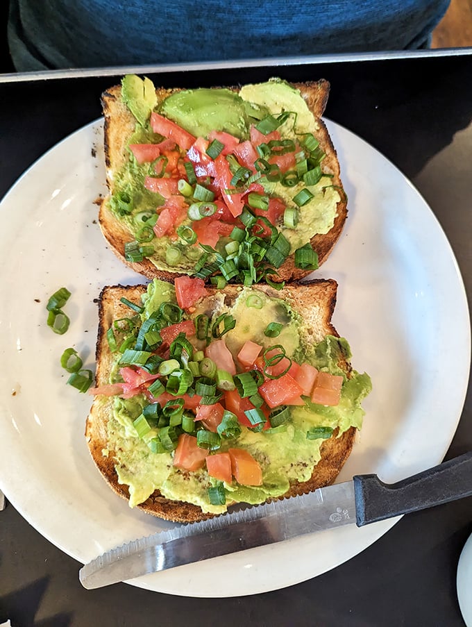 Avocado toast that would make a millennial weep with joy, while simultaneously satisfying a lumberjack's appetite. Green gold on perfectly toasted bread.
