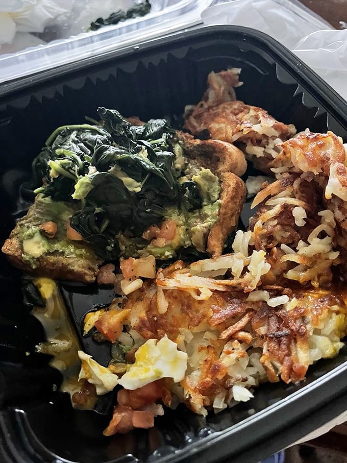 A hearty omelet packed with spinach and cheese – proof that sometimes the most satisfying meals come in to-go containers.