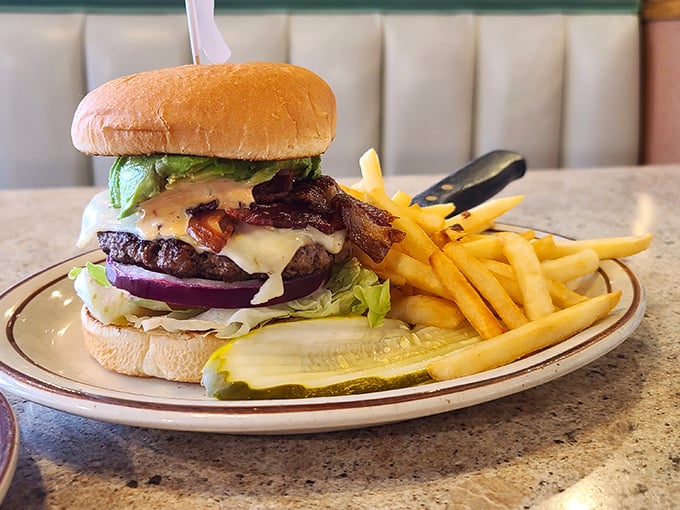 The burger that launched a thousand road trips. Perfectly stacked with bacon, cheese, and fresh veggies—this is architecture you can eat.