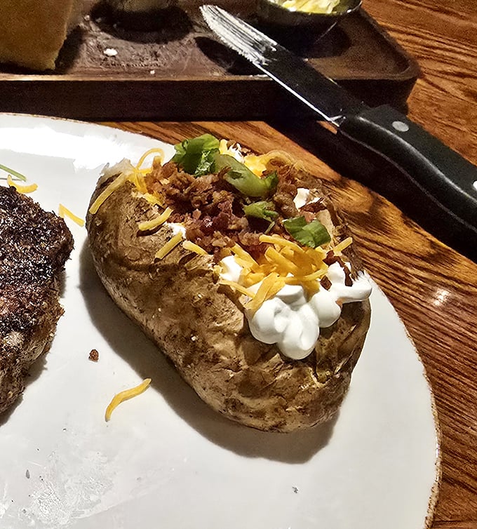 Not just any baked potato – a loaded masterpiece that's practically a meal itself. Cheese, bacon, and sour cream creating the holy trinity of potato perfection.
