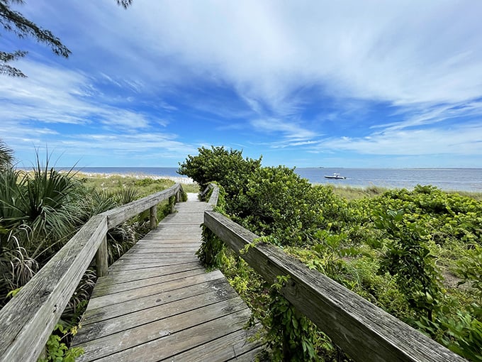 A wooden boardwalk parts the sea grapes, leading to Bean Point's pristine shores – Florida's version of the yellow brick road.