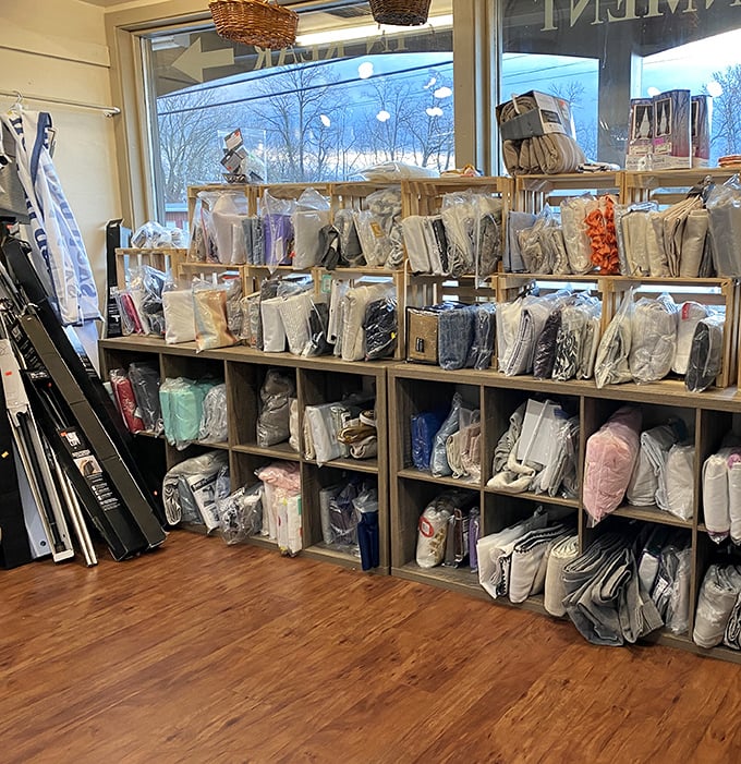 Bedding bonanza! These neatly organized shelves of linens and comforters prove one person's "no longer sparks joy" is another's decorating jackpot.