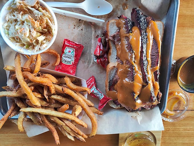 Brisket so tender it requires a moment of silence before eating. Those hand-cut fries and slaw aren't just sides—they're supporting actors deserving awards.