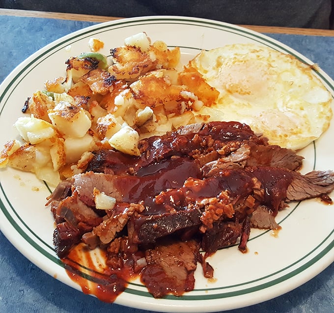 BBQ beef brisket with eggs and home fries – because sometimes breakfast needs to moonlight as dinner. The sauce alone deserves its own fan club.