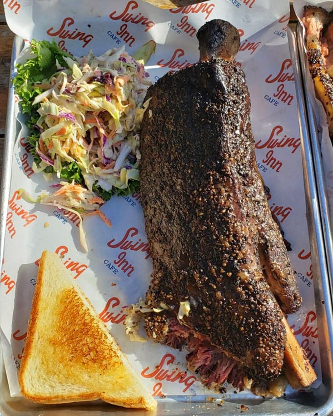 Barbecue poetry on a plate – this beef rib has the kind of smoke ring and bark that would make a Texas pitmaster tip their hat in approval.