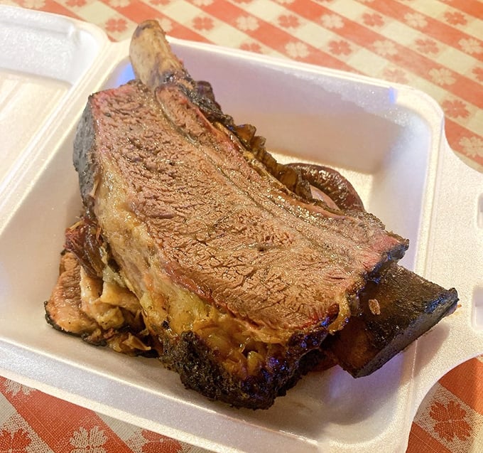 These beef ribs aren't just dinner, they're prehistoric monuments to smoke and patience—Fred Flintstone would weep with joy.