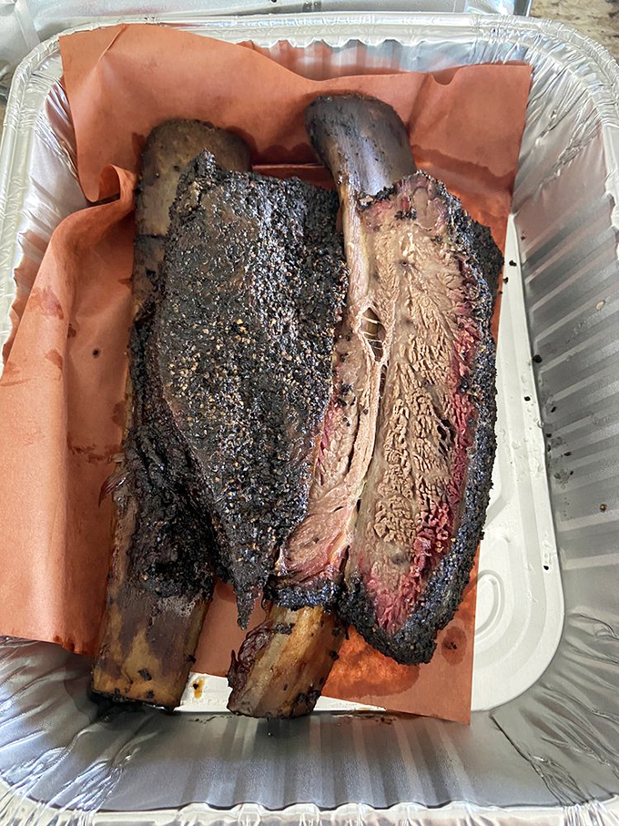 These beef ribs aren't just dinner; they're prehistoric monuments to smoking perfection. Fred Flintstone would trade his car for these beauties.