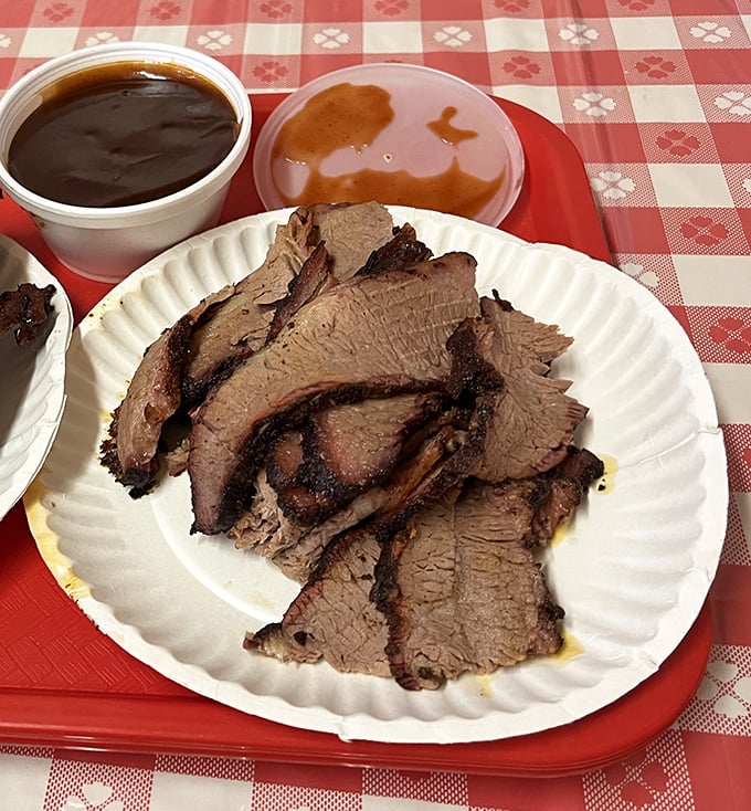 Brisket so tender it makes you want to write poetry. That smoke ring isn't just pretty—it's a badge of honor in the barbecue world.