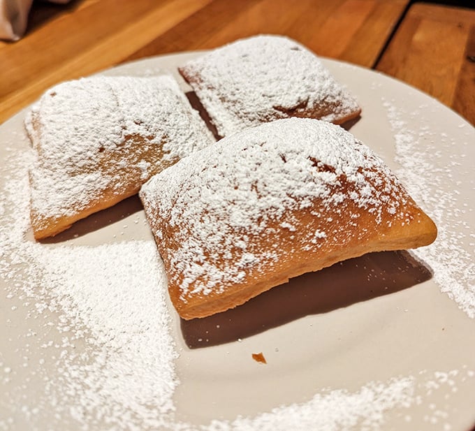 Beignets dusted with powdered sugar—because sometimes the simplest pleasures are the ones worth driving 25 miles for.