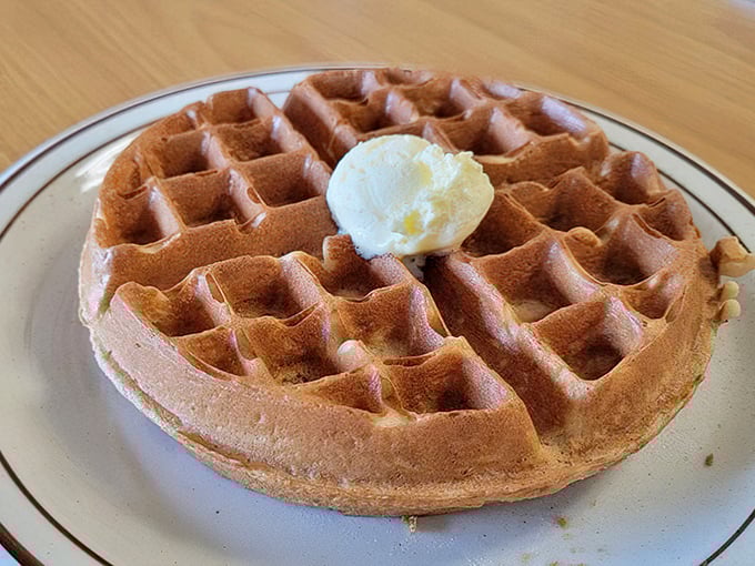 This Belgian waffle doesn't need fancy toppings to impress – just a perfect golden crust, tender interior, and a dollop of butter slowly melting into those squares.