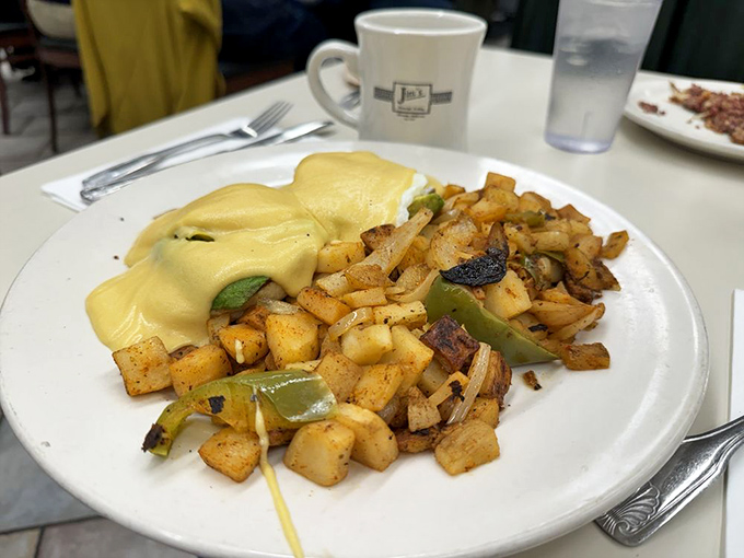 This Benedict isn't just breakfast, it's architecture – a perfectly balanced tower of flavors that Sir Christopher Wren would approve of.