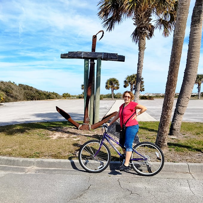 Biking alongside maritime history – that anchor isn't just decoration, it's a reminder that adventure has been happening here for centuries.