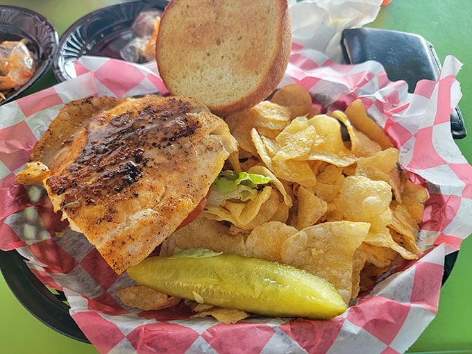 Blackened perfection meets crispy potato chips—this sandwich doesn't need fancy plating when it tastes like Florida sunshine on a bun.