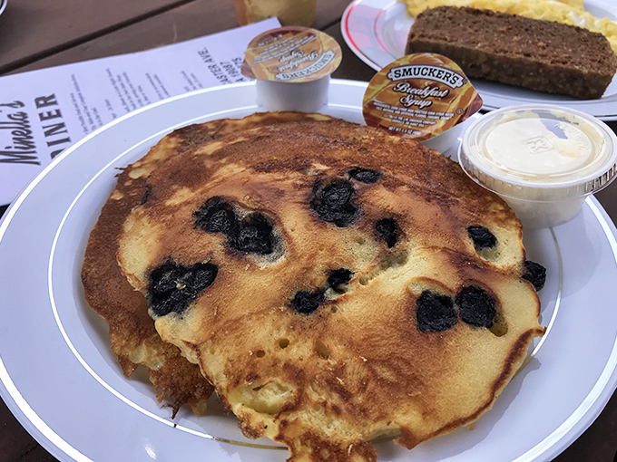 Blueberry pancakes the size of small frisbees arrive golden and ready for their syrup bath. Breakfast doesn't get more American than this Main Line masterpiece.