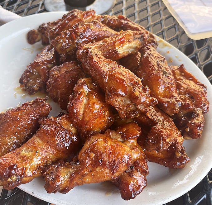 Wings that don't mess around – crispy, saucy, and demanding to be devoured with the kind of enthusiasm usually reserved for finding money in old pants.