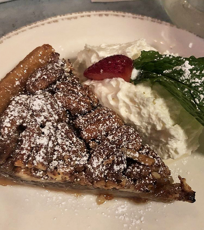 This isn't just pecan pie – it's Southern comfort wrapped in a flaky crust with a side of nostalgia that'll make you call your grandmother.