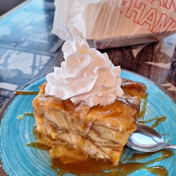 Bread pudding that doesn't just speak to your soul – it sings a full-on power ballad, complete with caramel sauce and that perfect whipped cream encore.