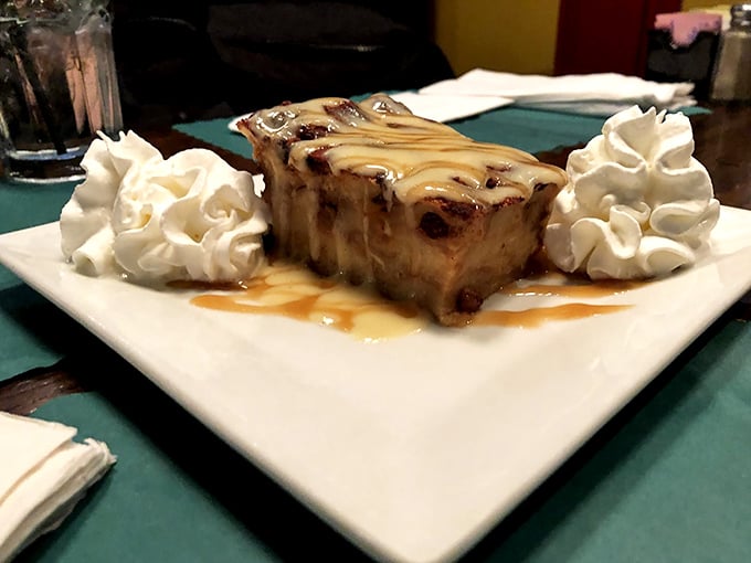 Bread pudding that makes you close your eyes when you take a bite. The whipped cream isn't garnish—it's the supporting actor in this dessert drama.