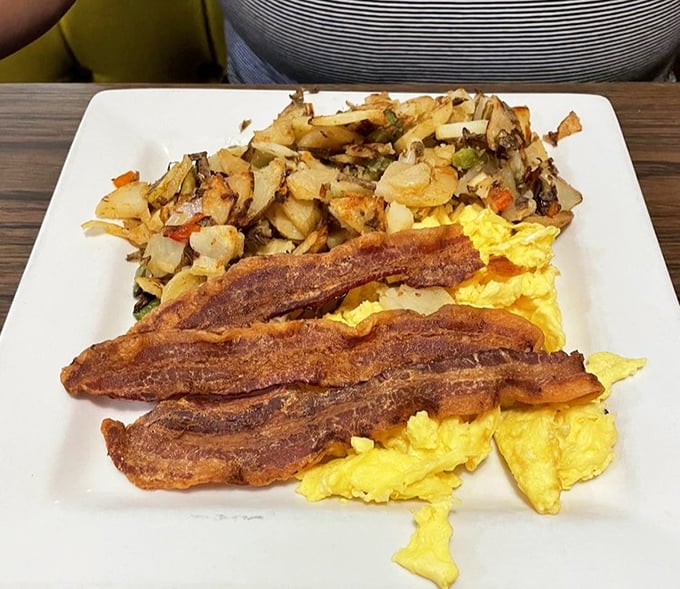 Crispy bacon, fluffy scrambled eggs, and seasoned potatoes – the holy trinity of breakfast done right at this Santa Ana gem.