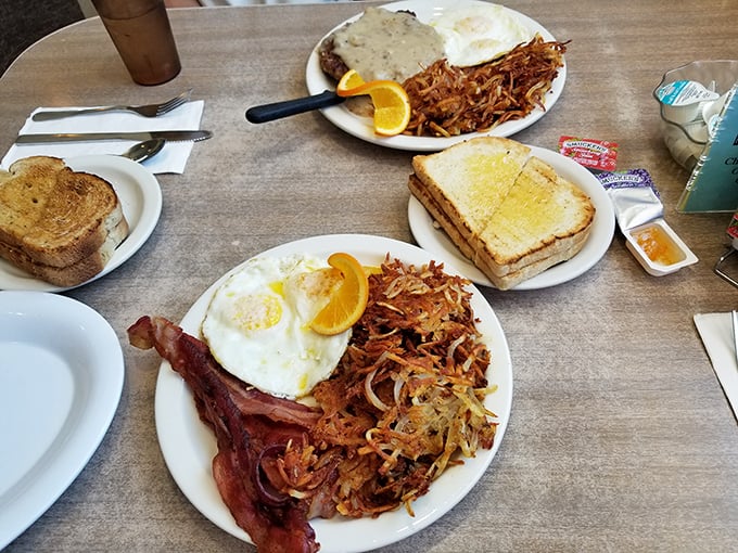 Breakfast of champions! Crispy hash browns, farm-fresh eggs, and that bacon—oh that bacon—cooked to that perfect point between chewy and crisp.