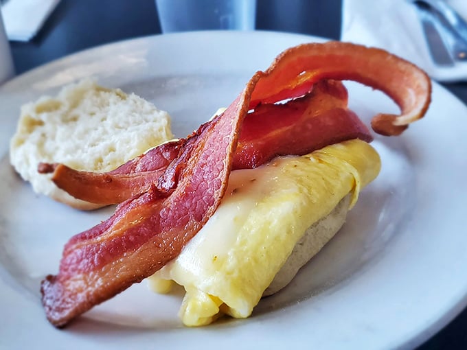 Breakfast sandwich perfection: fluffy eggs and crispy bacon nestled between bread. Simple math: protein + carbs = morning victory.