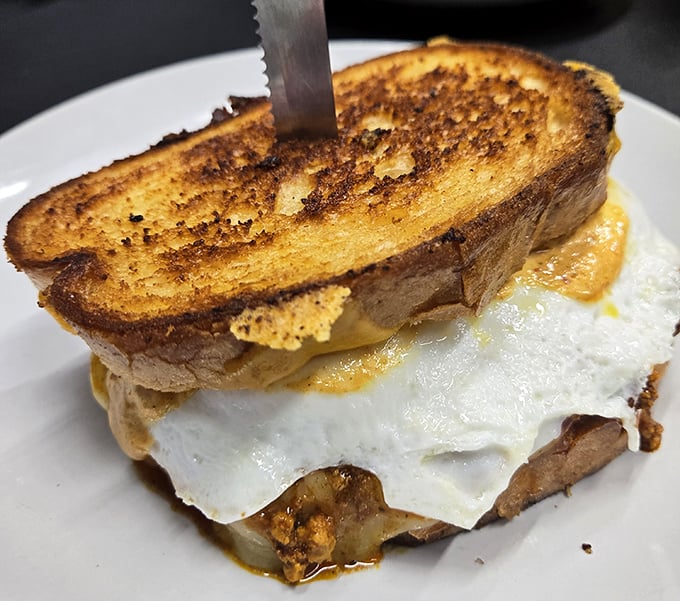 Breakfast sandwich perfection: where the humble egg meets melty cheese in a relationship so right it should have its own romance novel.