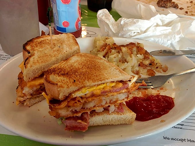 This isn't just a sandwich—it's an architectural marvel of toasted bread, melted cheese, and savory meats that demands both hands and napkins.