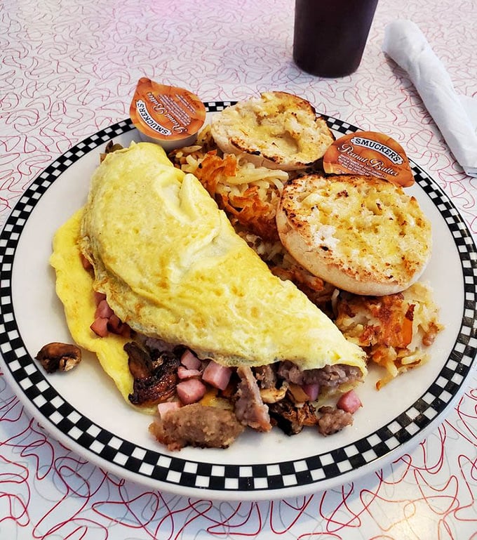 This isn't just breakfast—it's morning therapy. A perfect omelet with a side of golden hash browns and buttery English muffins that make hitting the snooze button worth it.