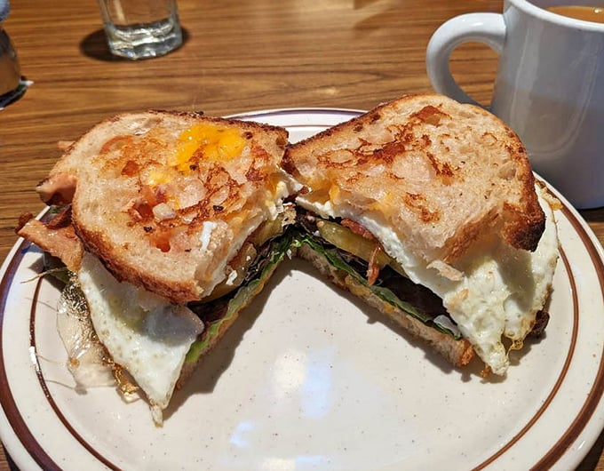 This breakfast sandwich isn't just food—it's architecture, engineering, and art all stacked between perfectly toasted bread with that runny egg center.