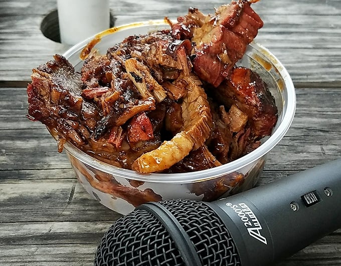This isn't just brisket – it's a time capsule of smoke, patience, and pitmaster wisdom, served in a humble container that can barely contain its glory.